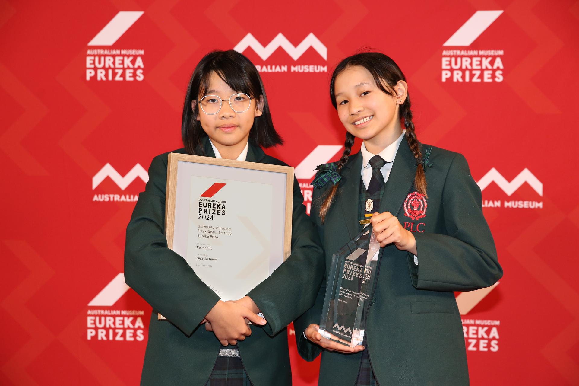 Eugenia Yeung, runner-up, and Cate Yuen, winner, of the Primary School category.